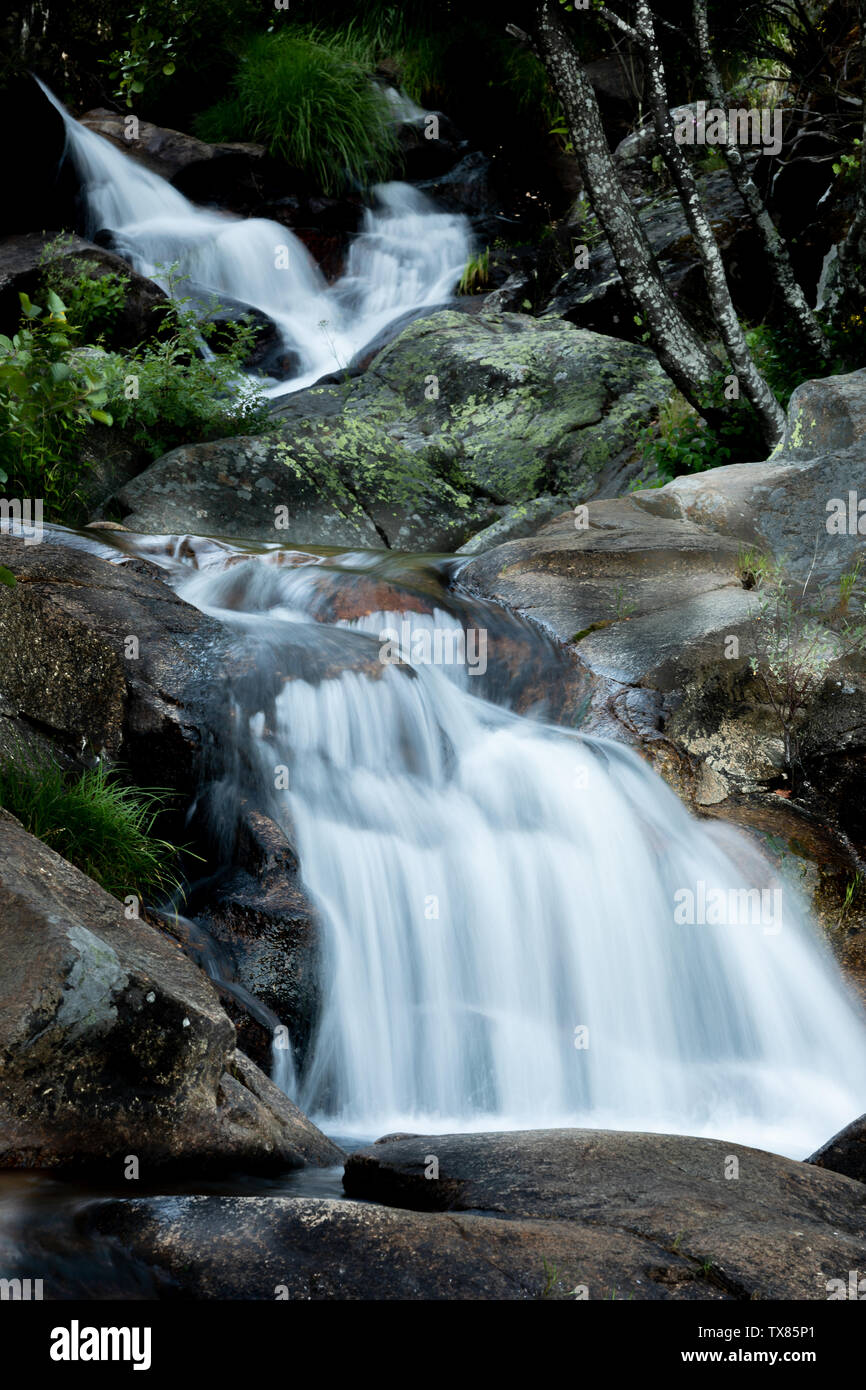 Beautiful waterfall falling on the stones Stock Photo - Alamy