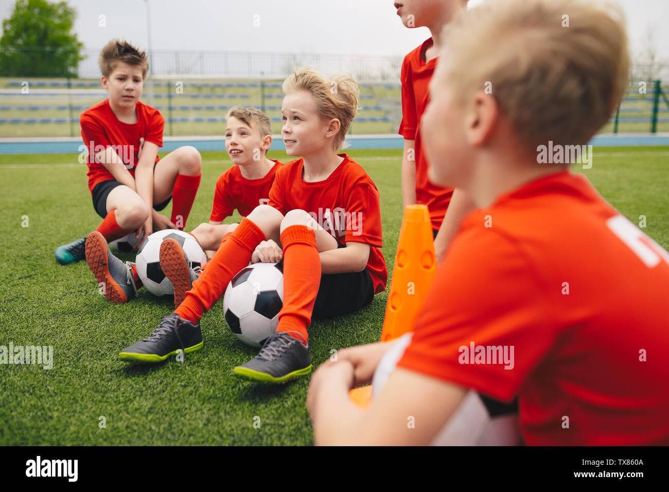 Happy kids in school sports team. Boys gathering and having fun on ...
