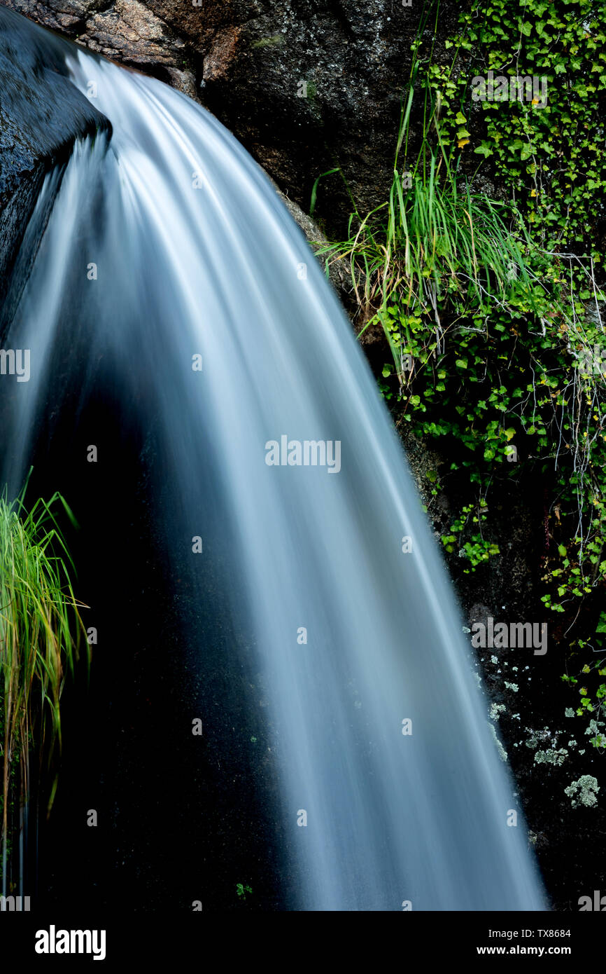 Beautiful waterfall falling on the stones Stock Photo - Alamy