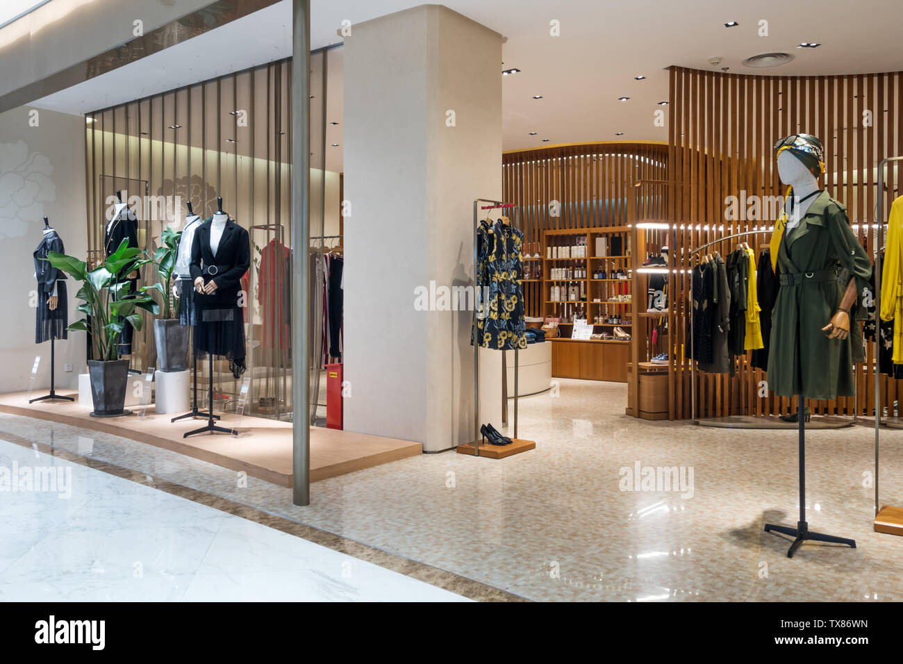 fashionable clothes in modern shopping mall Stock Photo - Alamy
