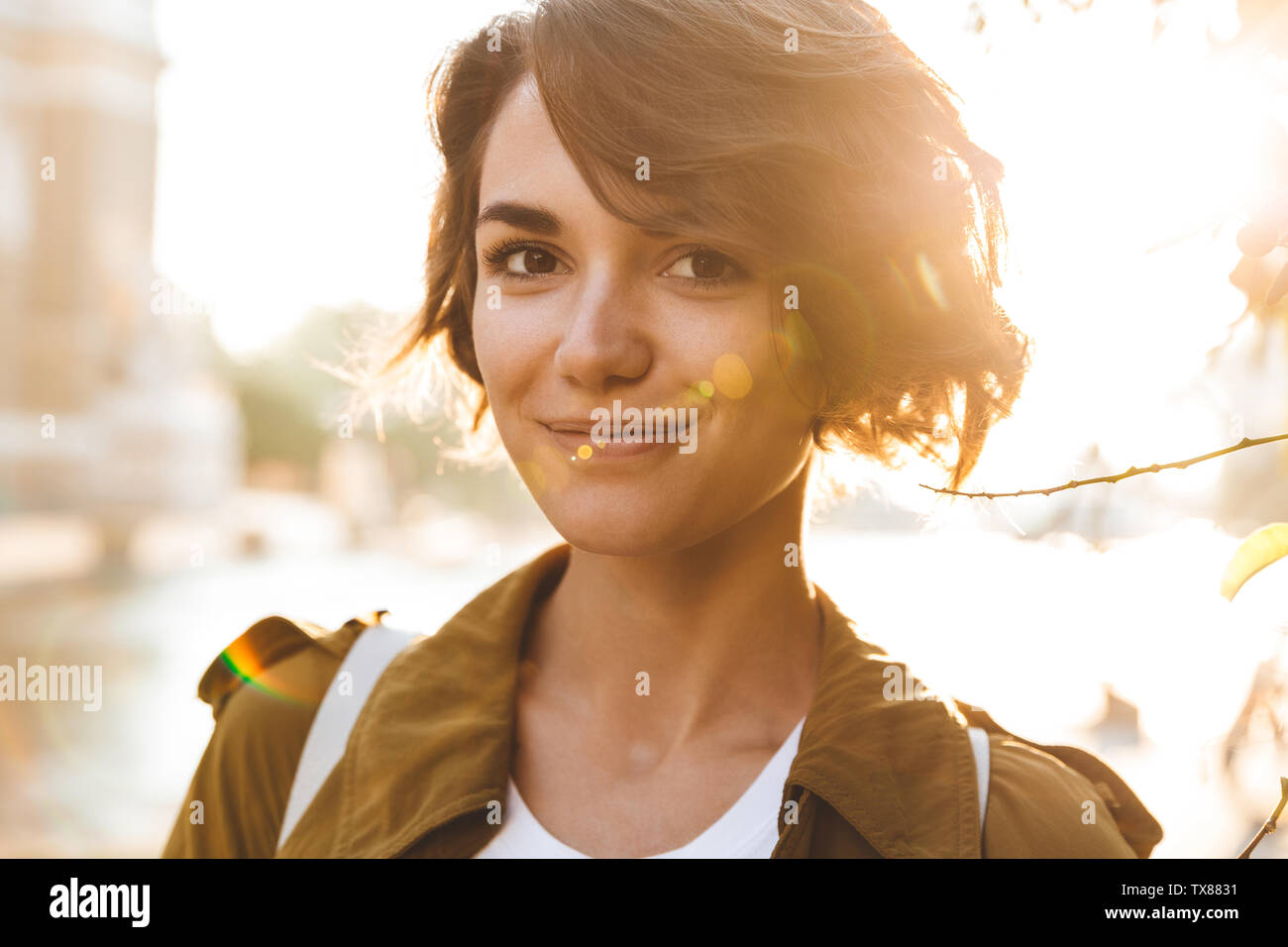 Image of a cute young amazing woman walking outdoors in park in ...