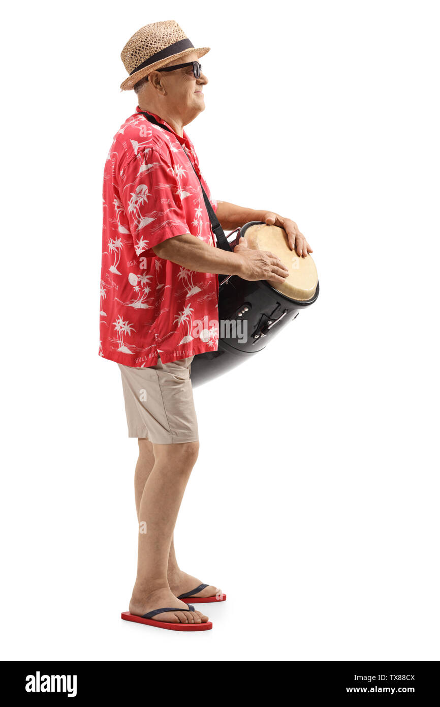 Full length profile shot of a mature man playing conga drums isolated ...