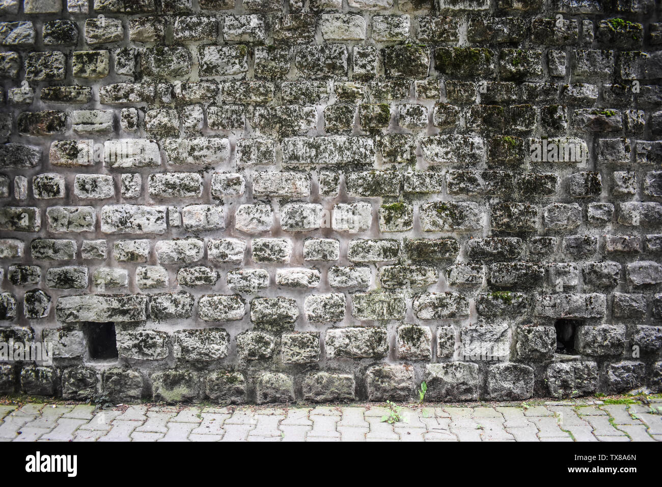 Ancient stone blocks pattern on the fortress wall surface. Gray stone ...