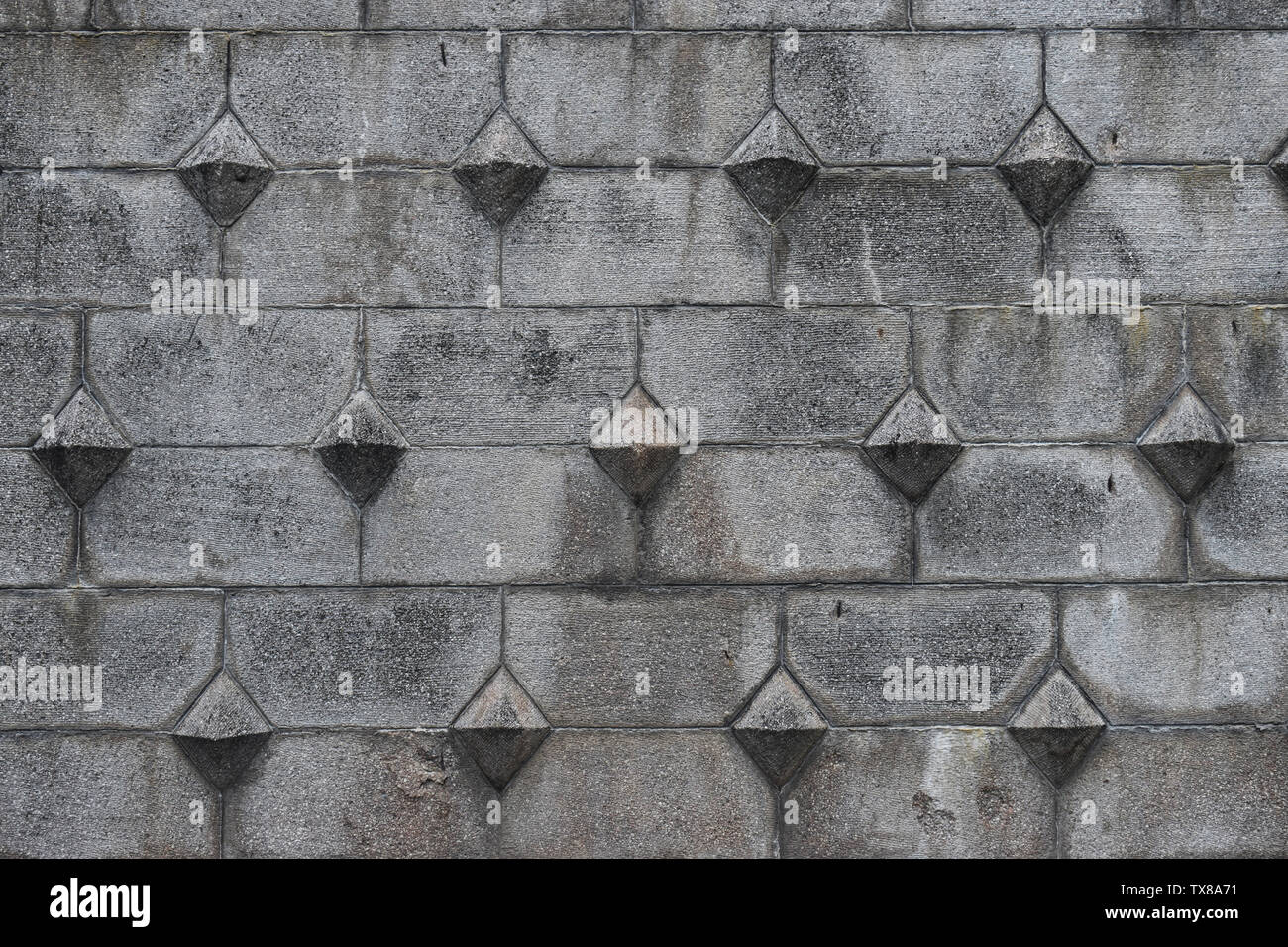 Ancient stone blocks pattern on the fortress wall surface. Gray stone ...