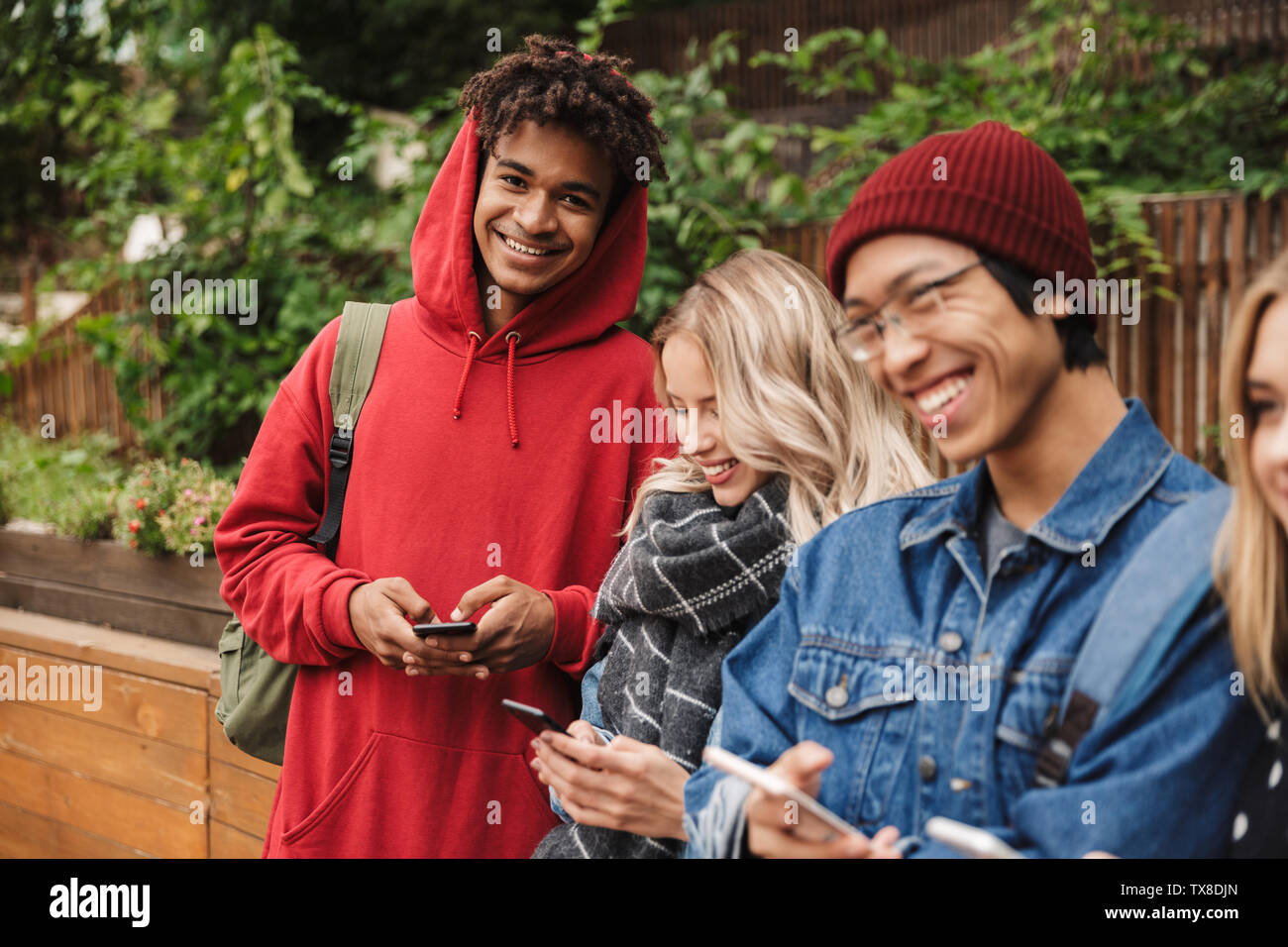 Group if cheerful multiethnic friends teenagers spending fun time ...