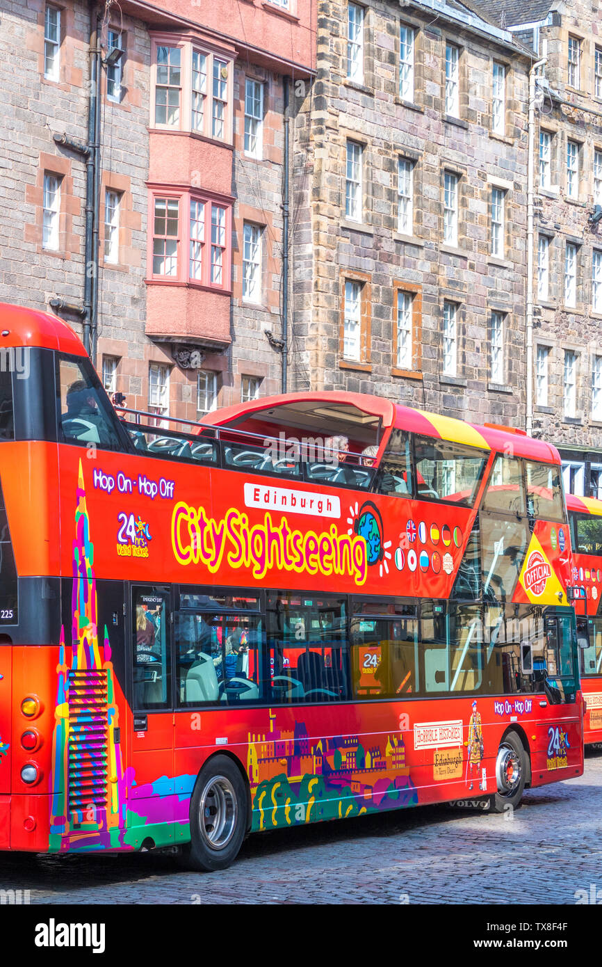 Open top city sightseeing bus working its way along the Royal Mile ...