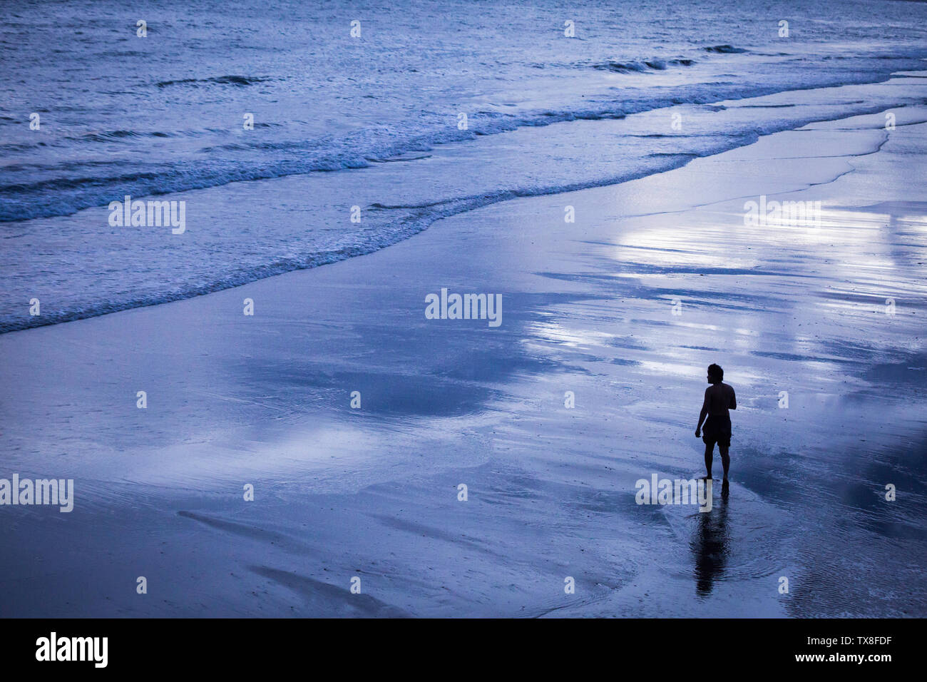 Shadow on the beach Stock Photo - Alamy