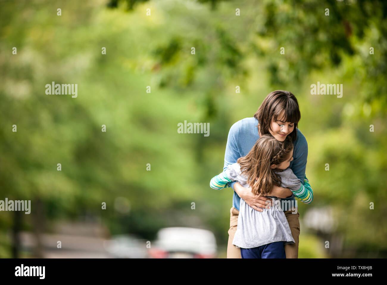 Mother hugging daughter outdoor hi-res stock photography and images - Alamy