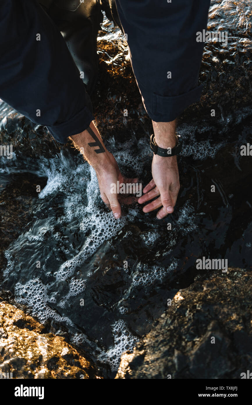 Man washing hands river hi-res stock photography and images - Alamy