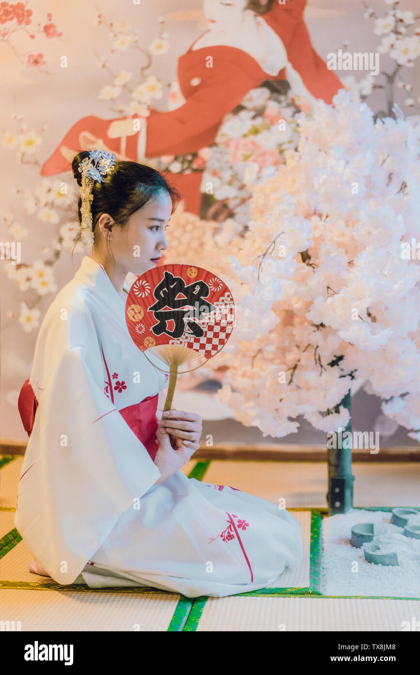 Demure asian woman hi-res stock photography and images - Alamy