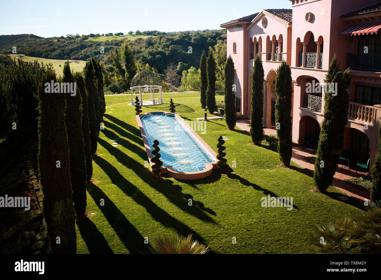 Back yard and swimming pool of a luxury mansion Stock Photo - Alamy
