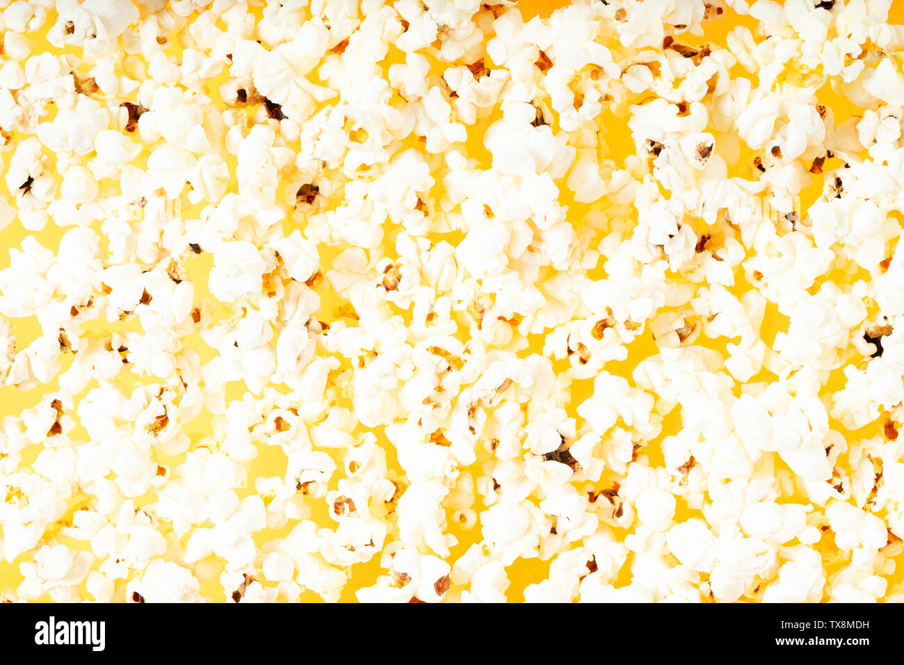 Scattered salted popcorn food textured background Stock Photo - Alamy