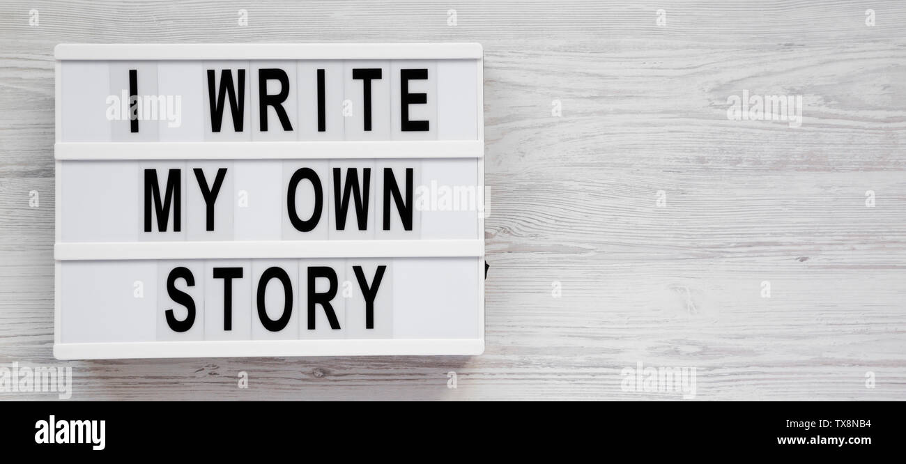 'I write my own story' words on a lightbox on a white wooden background ...