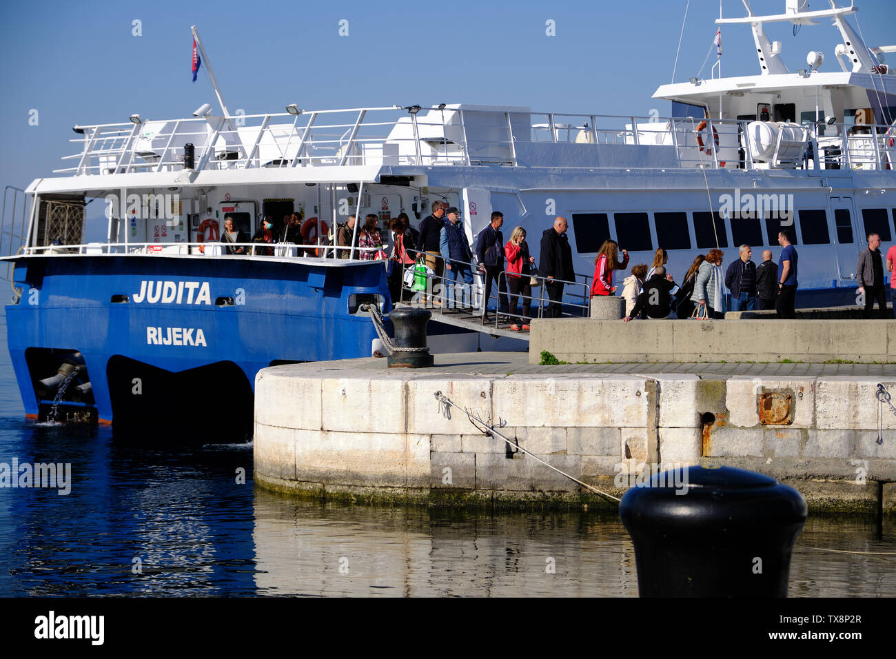 Passengers disembarking the Judita ferry arrival in the port. Getting ...