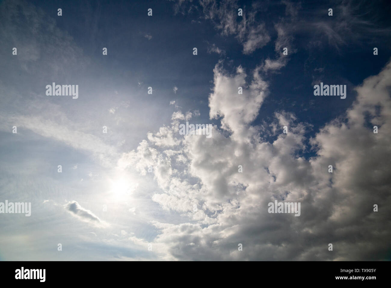 white clouds at noon daylight wide angle shot Stock Photo - Alamy