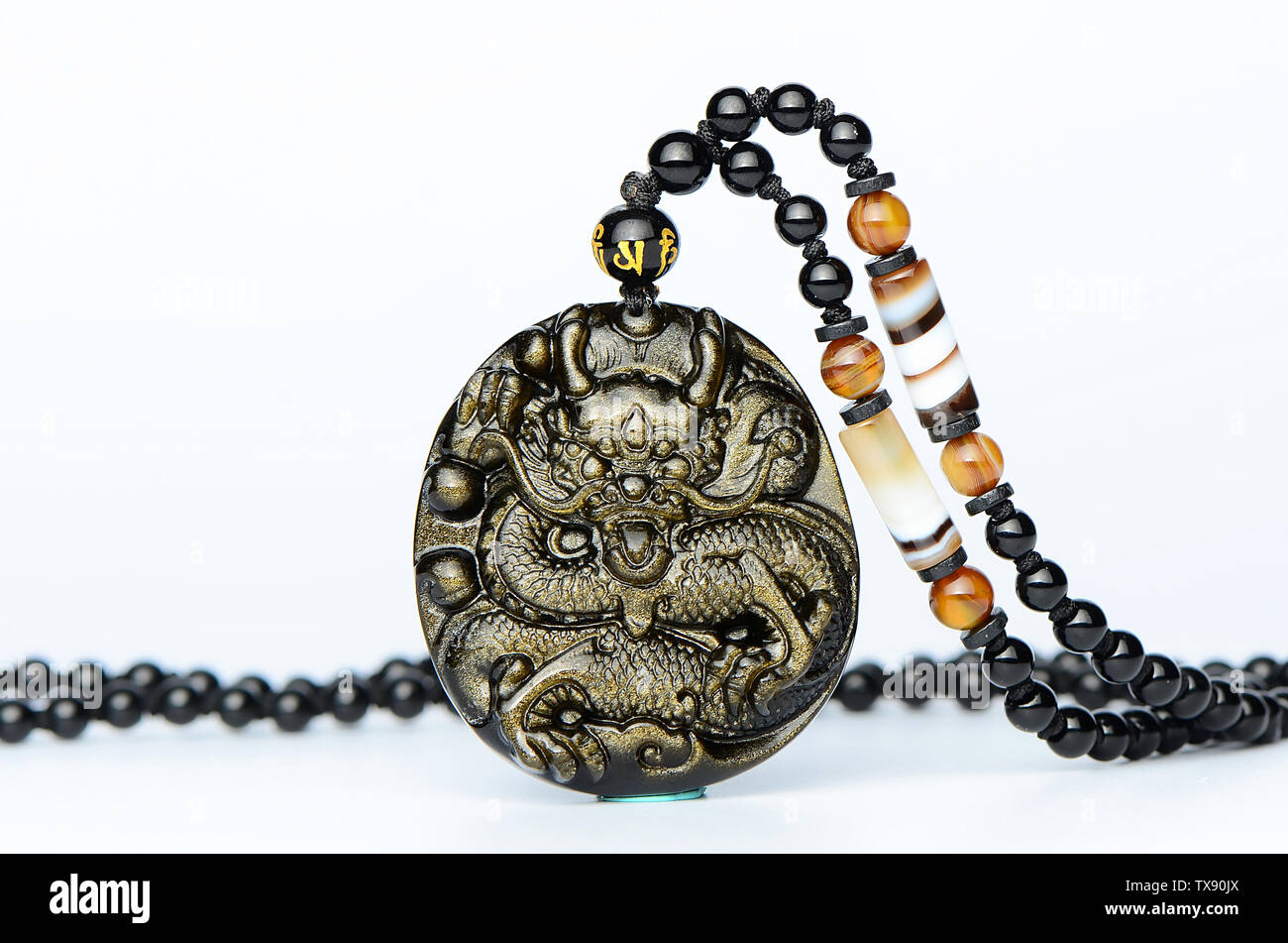 Obsidian guardian god dragon dragon pendant hi-res stock photography ...
