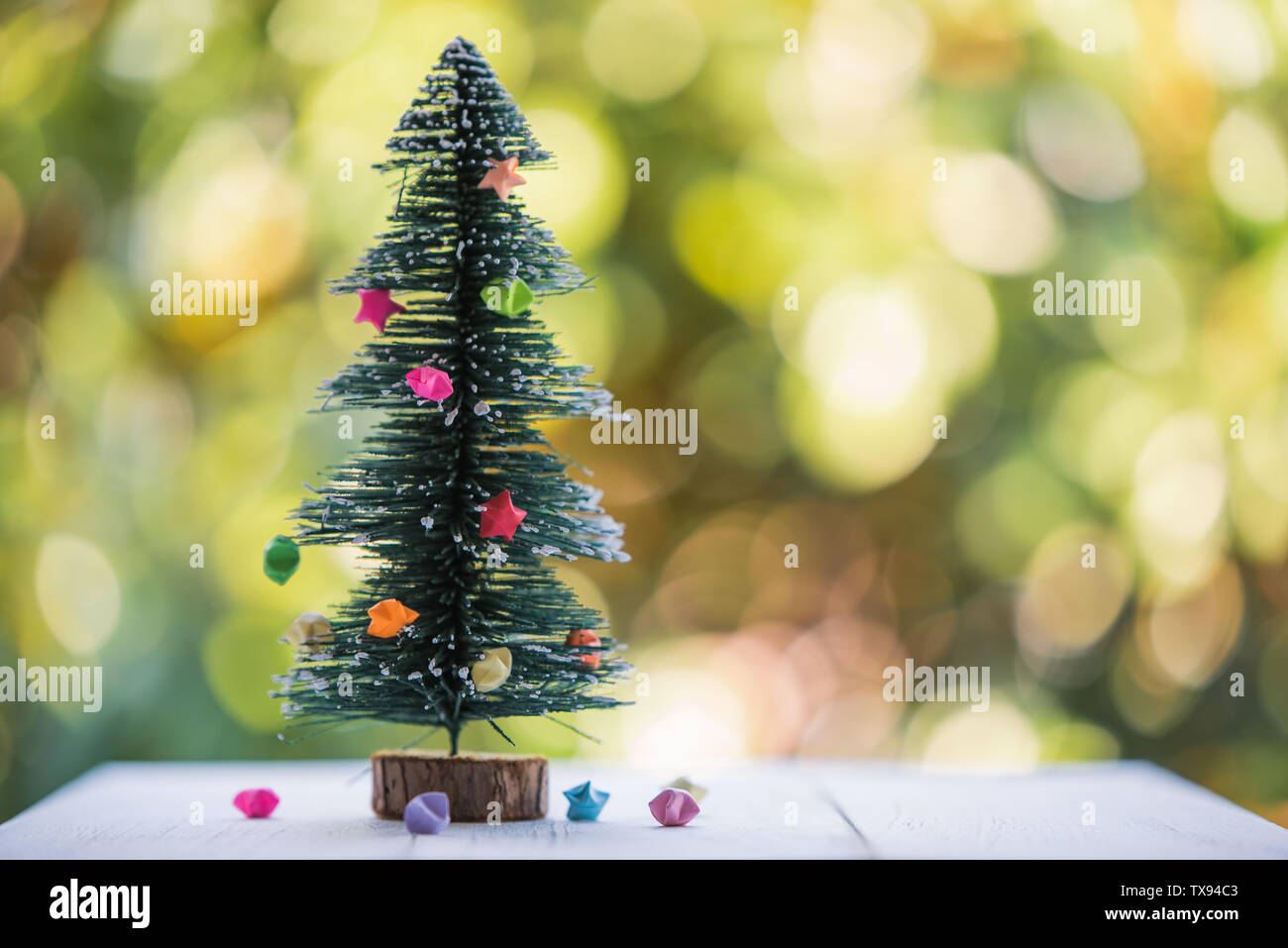 Christmas tree in colorful background Stock Photo - Alamy