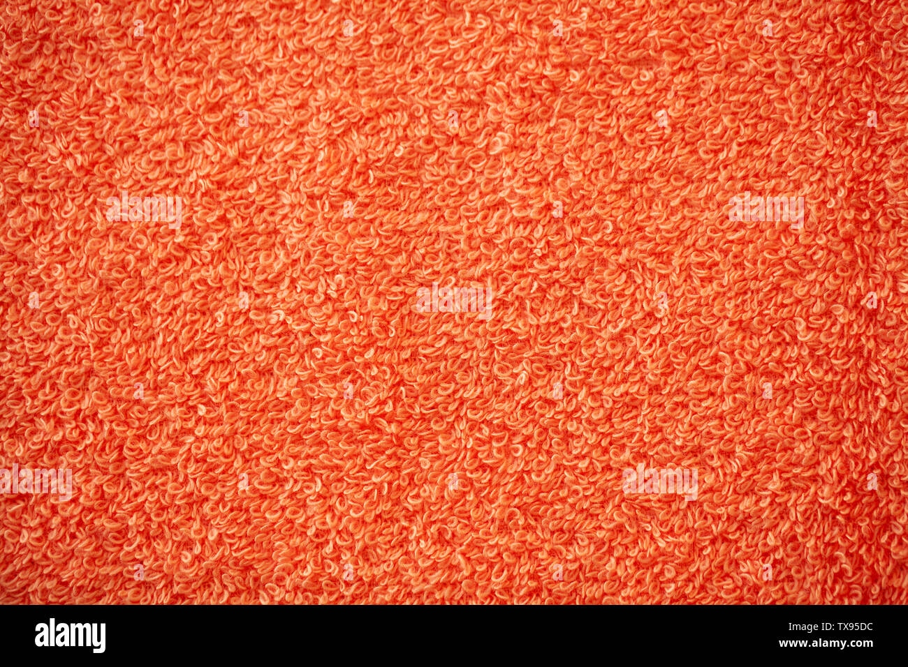 Red terry natural cotton towel background texture Stock Photo - Alamy