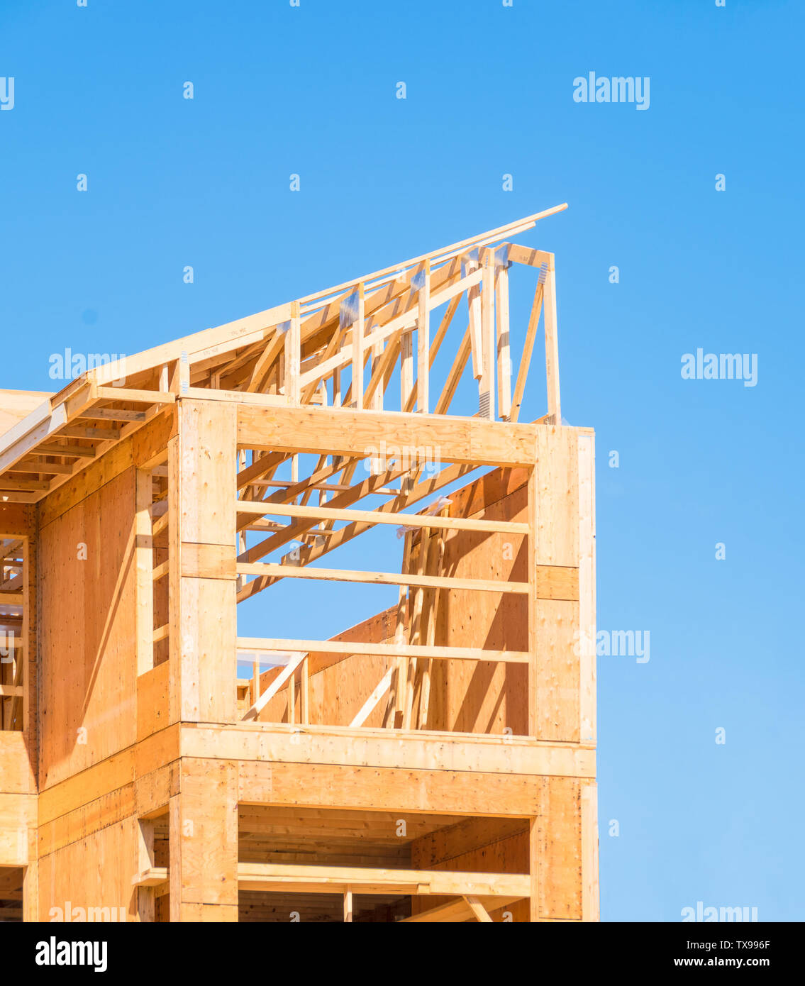 New apartment building under construction on sunny day on blue sky ...