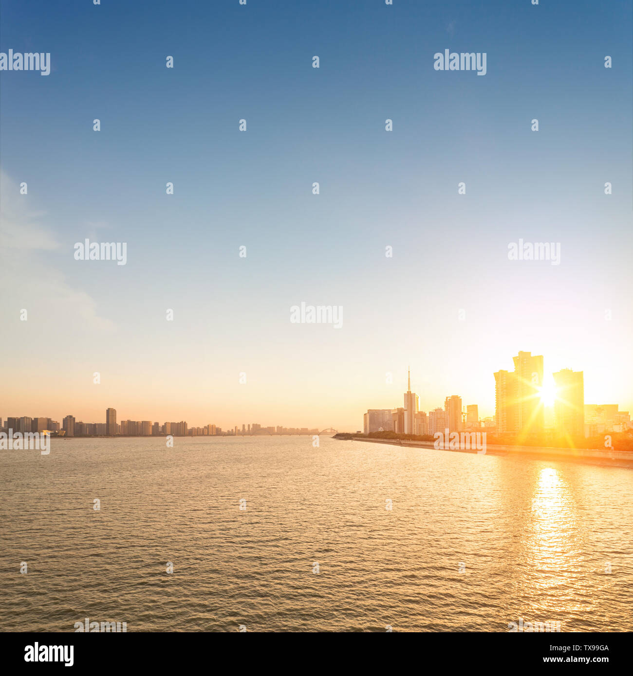 Cityscape with sunset Stock Photo - Alamy