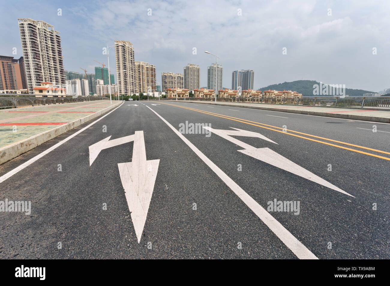 Arrow sign in modern city Stock Photo - Alamy