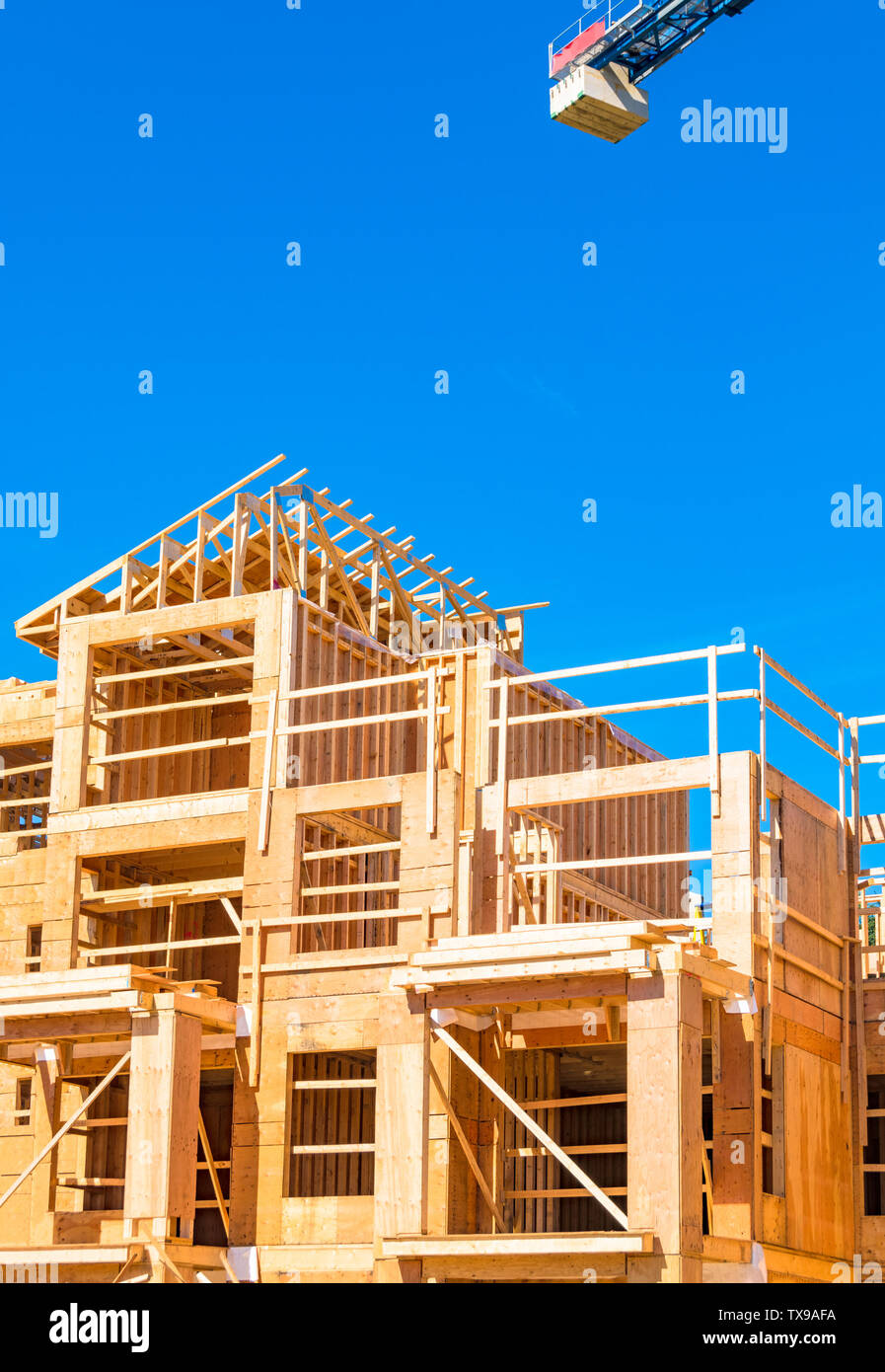 New residential building under construction with the crane above Stock ...