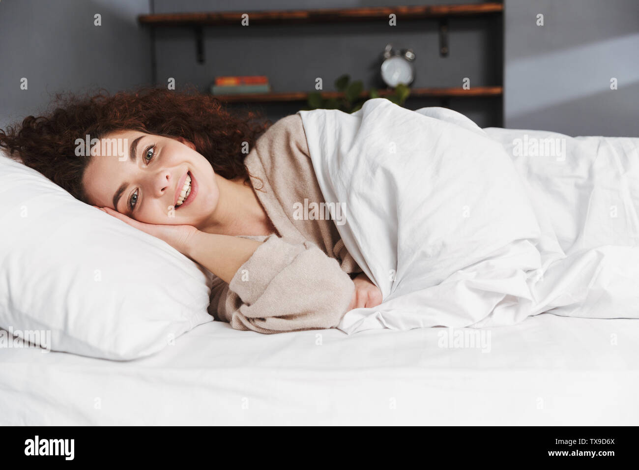 Photo of caucasian young woman wearing house clothes sleeping in bed on ...