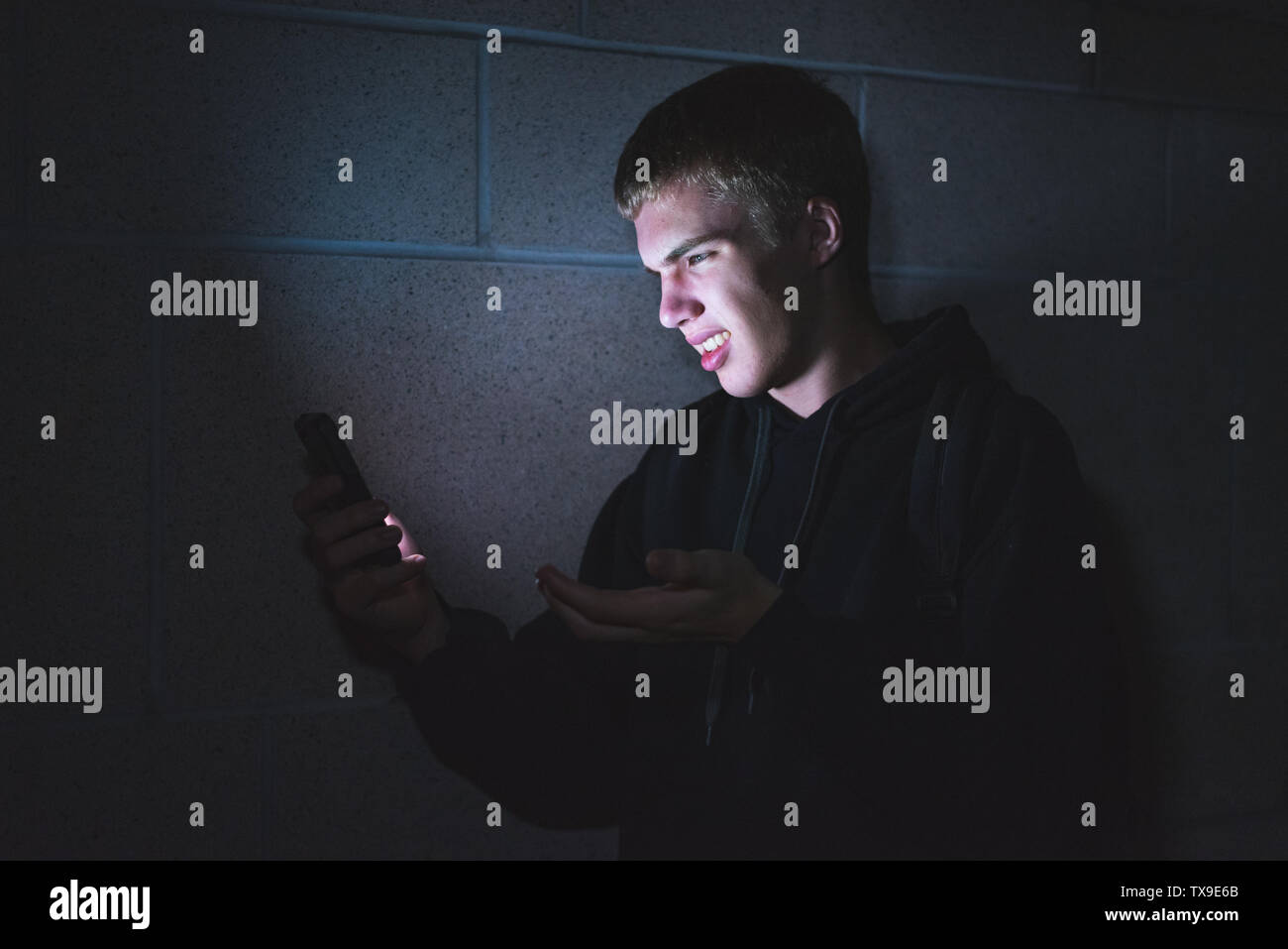 Teen boy confused reading hi-res stock photography and images - Alamy