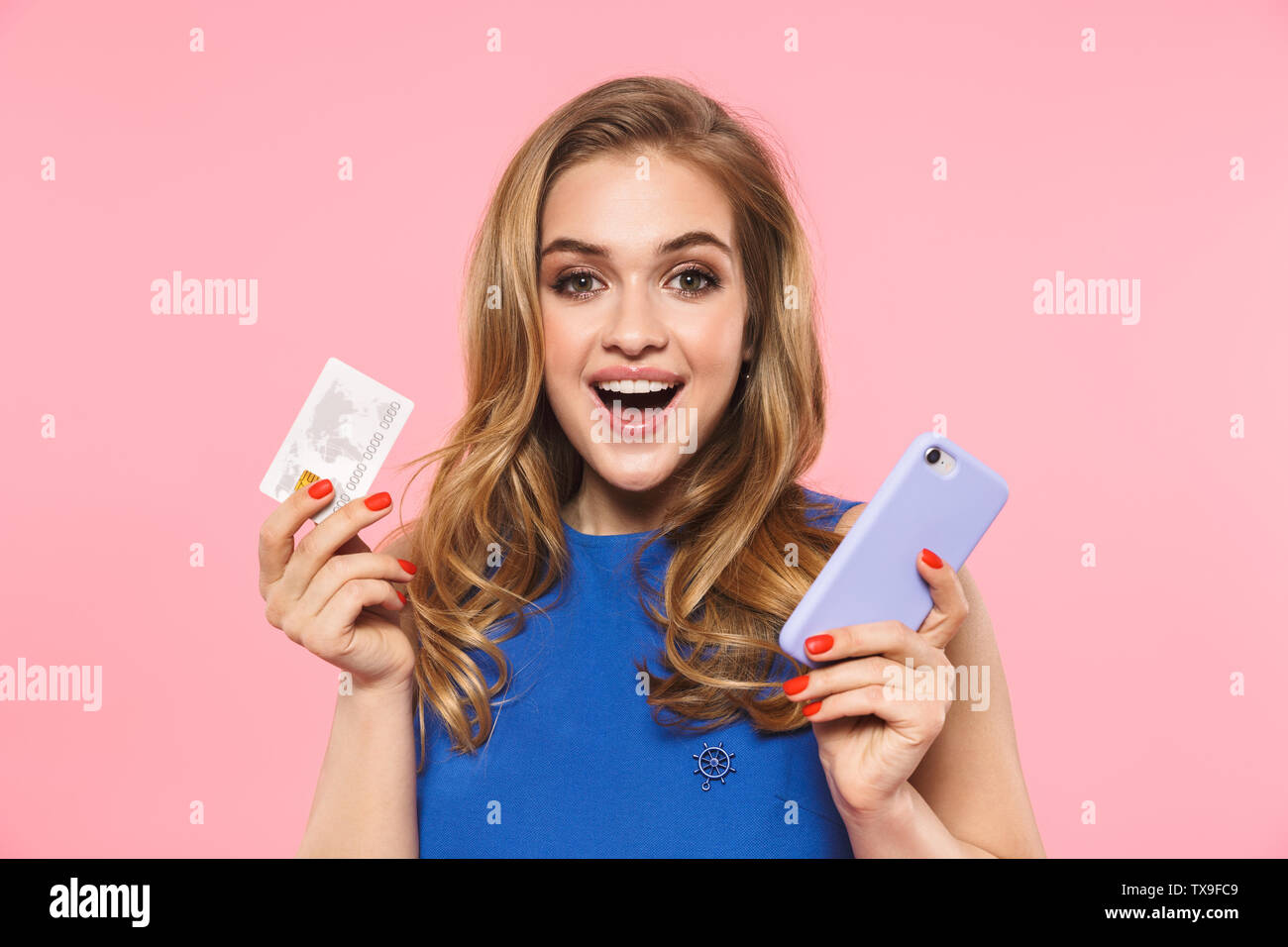 Image of a beautiful happy young pretty woman posing isolated over pink ...
