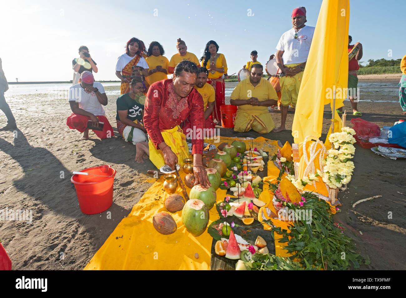 Devout Hindu worshippers prepare offerings to their deitied prior to ...
