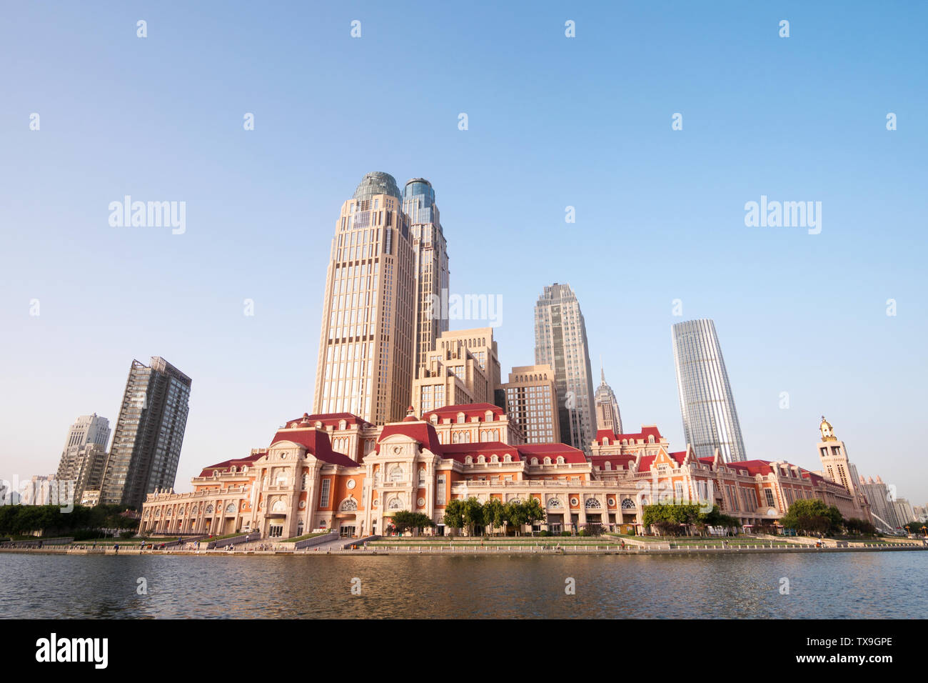 modern buildings near water in midtown of modern city Stock Photo - Alamy