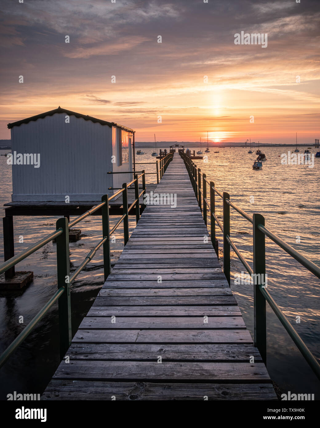 Wooden jetty at sunrise hi-res stock photography and images - Alamy