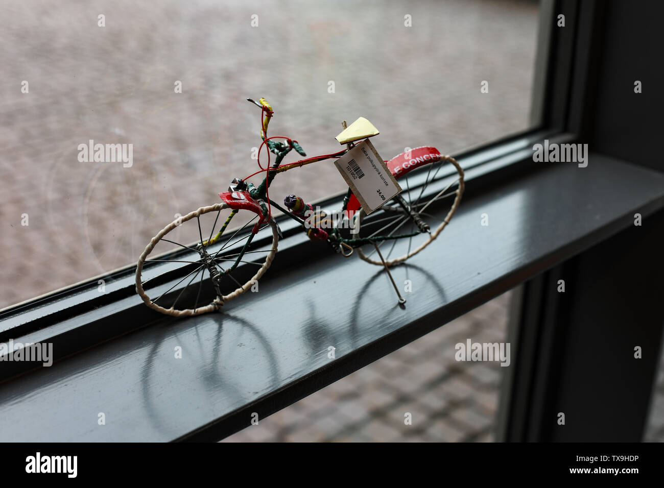 Miniature bike on museum shop window sill in Helsinki, Finland Stock ...