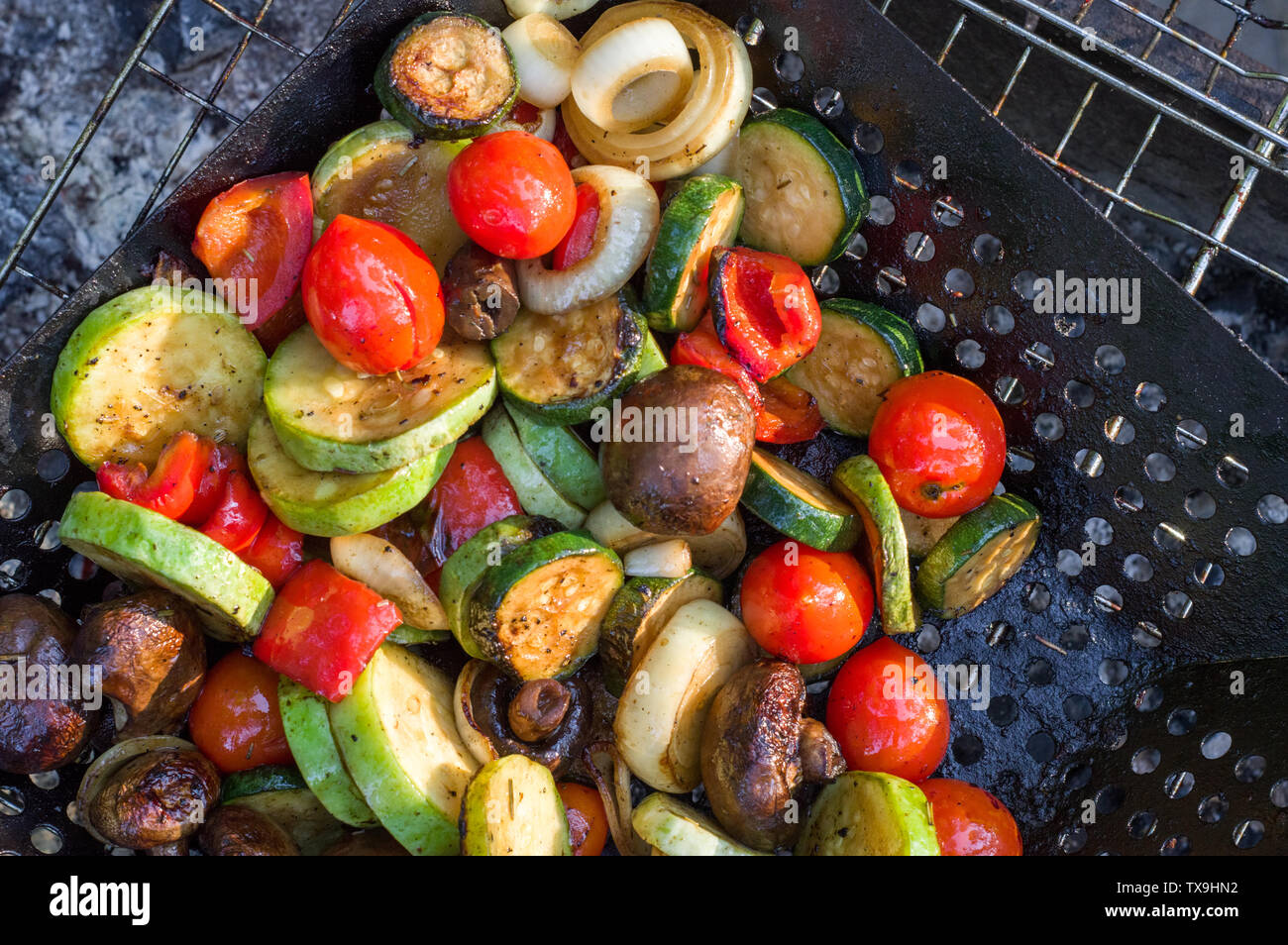 Cooking vegetables on the grill. Vegetables on the fire Stock Photo - Alamy