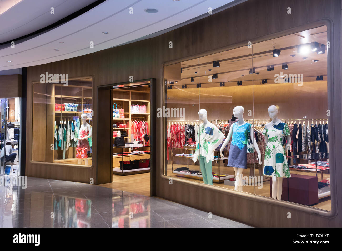 Boutique display window with mannequins in fashionable dresses Stock ...