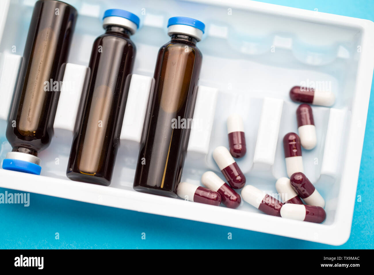 Capsules and oral liquid Stock Photo - Alamy