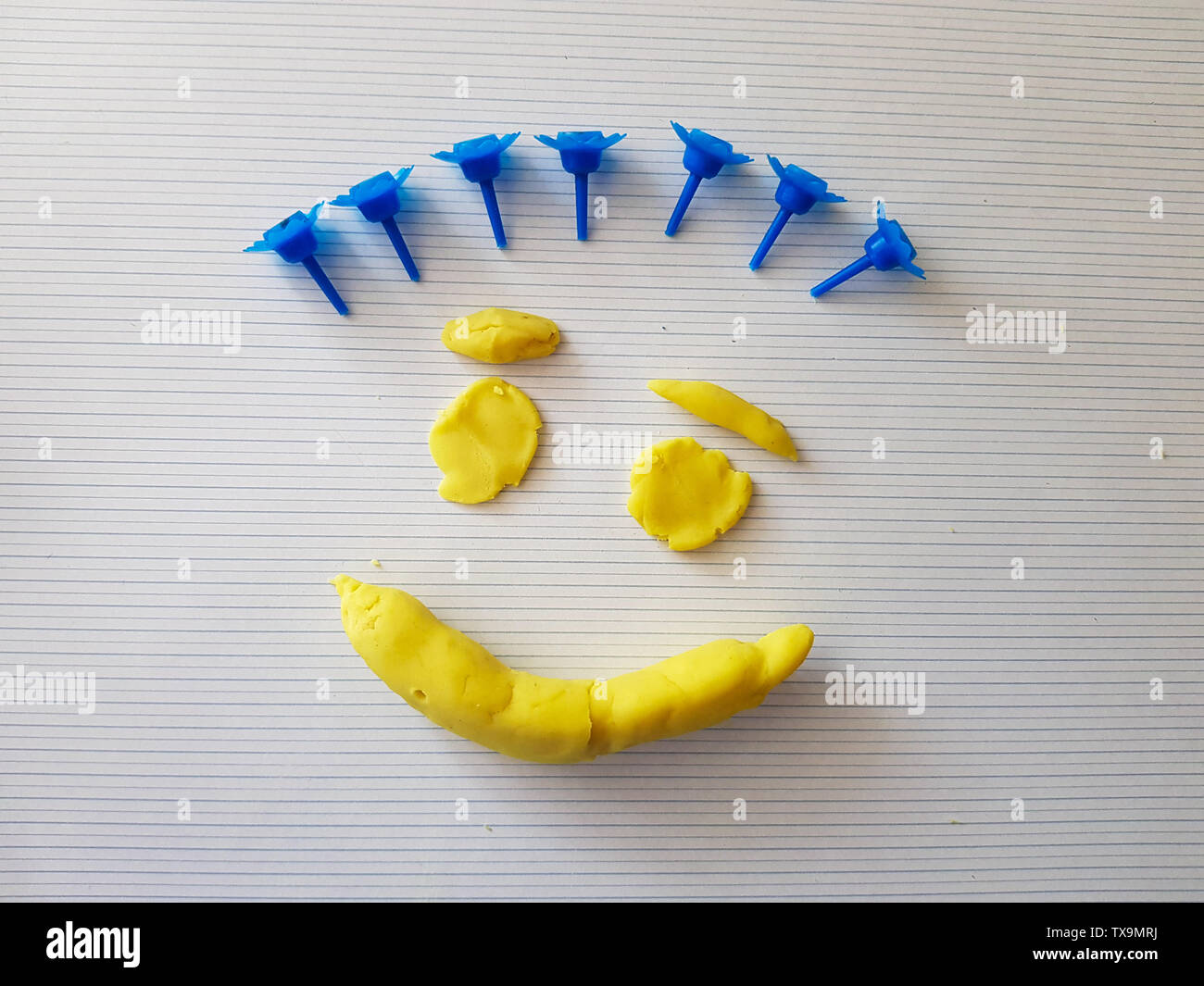 Fanny face made of a modeling clay. Mede by child Stock Photo - Alamy