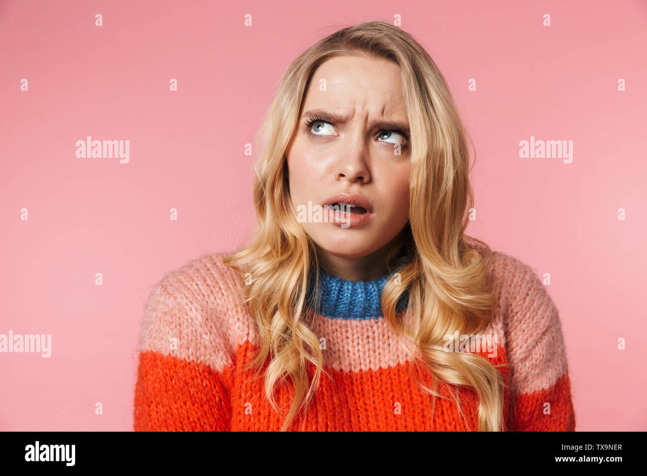 Image of a displeased young pretty beautiful woman posing isolated over ...