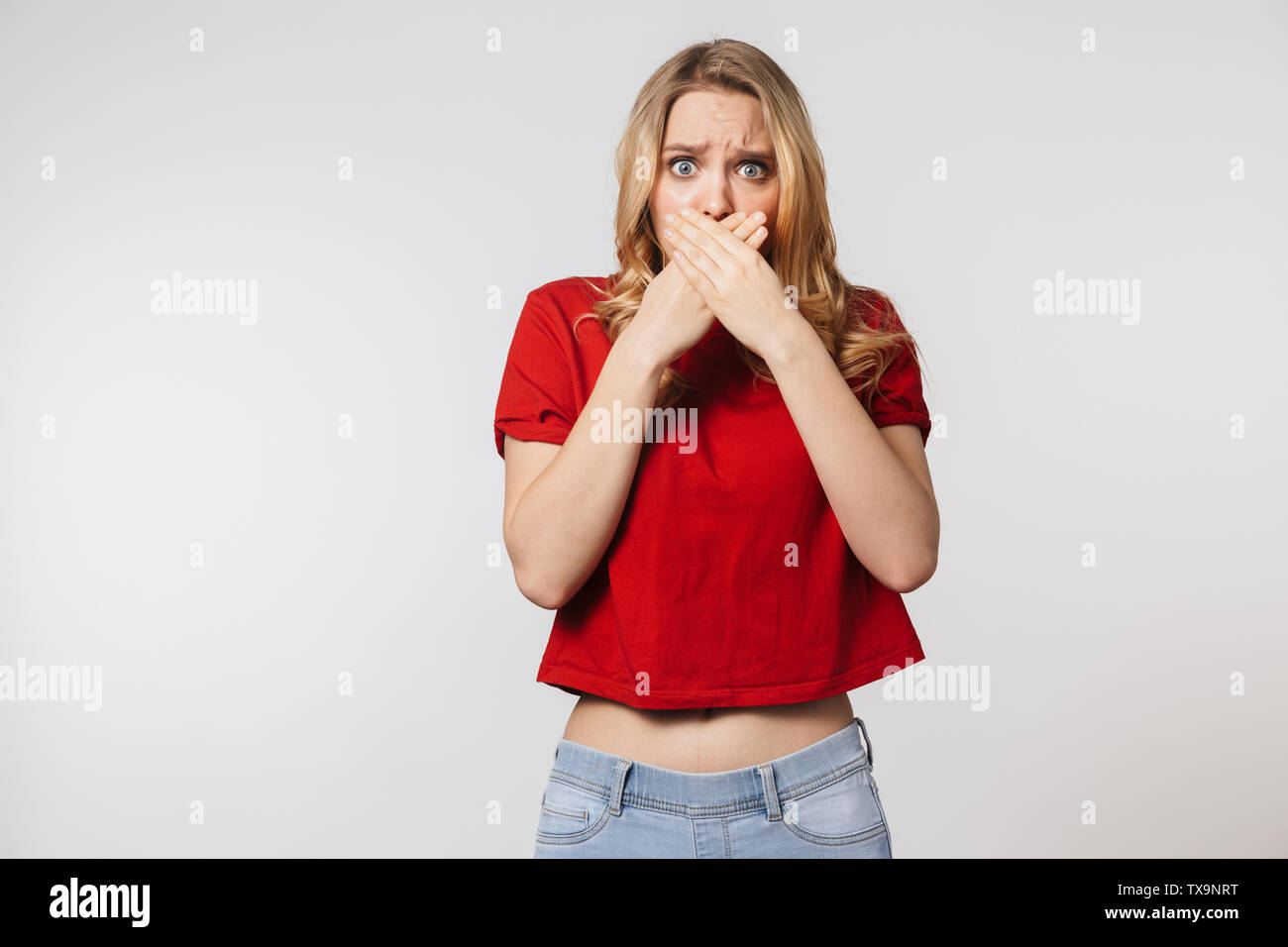 Image of confused scared young pretty beautiful woman posing isolated ...