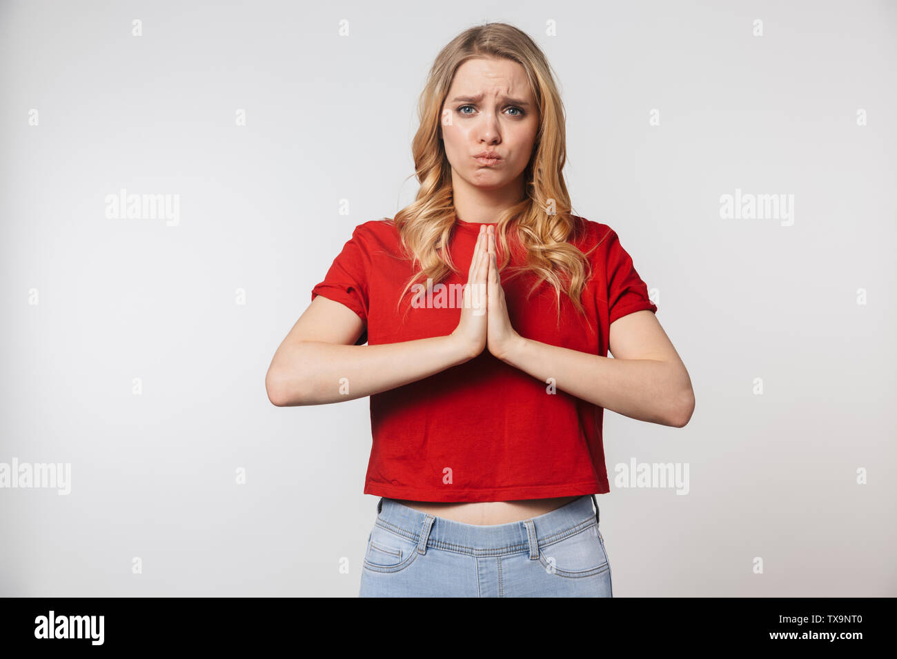 Image of nervous young pretty beautiful woman posing isolated over ...