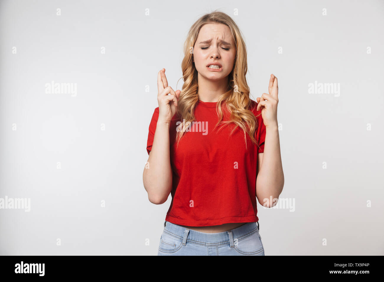 Image of nervous young pretty beautiful woman posing isolated over ...