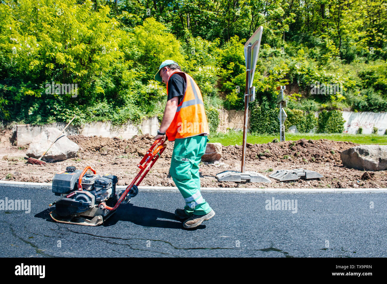France - May 14, 2014: Side view of male worker working with industrial ...