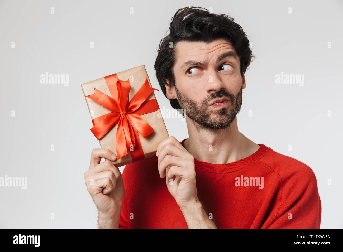 Image of a handsome young thinking nervous man posing isolated over ...