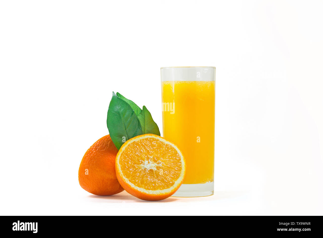 Open oranges and a glass of orange juice Stock Photo - Alamy