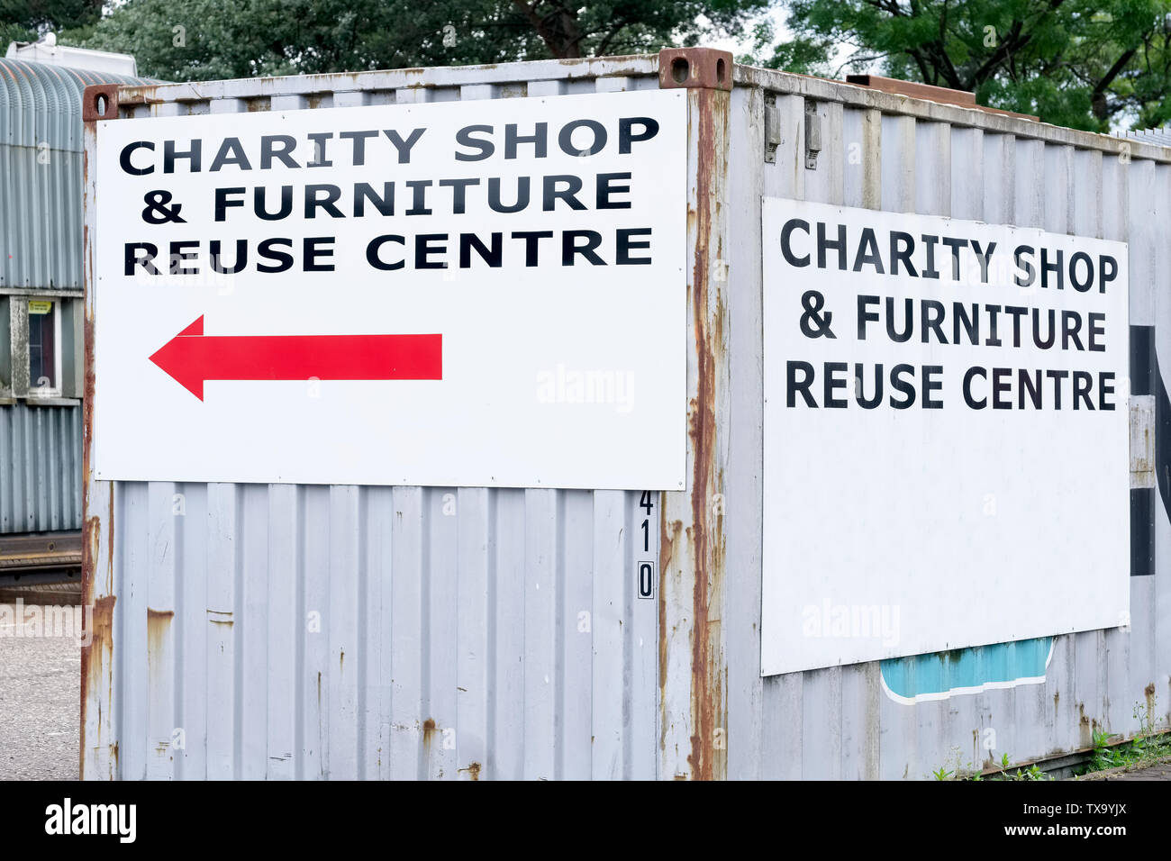 Charity and furniture shop reuse centre sign on steel container Stock ...