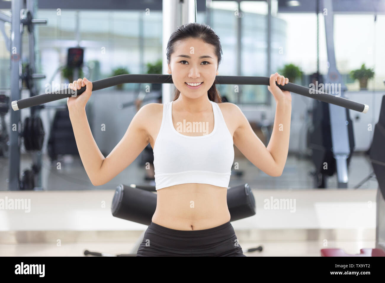 beautiful girl working out in modern gym Stock Photo - Alamy