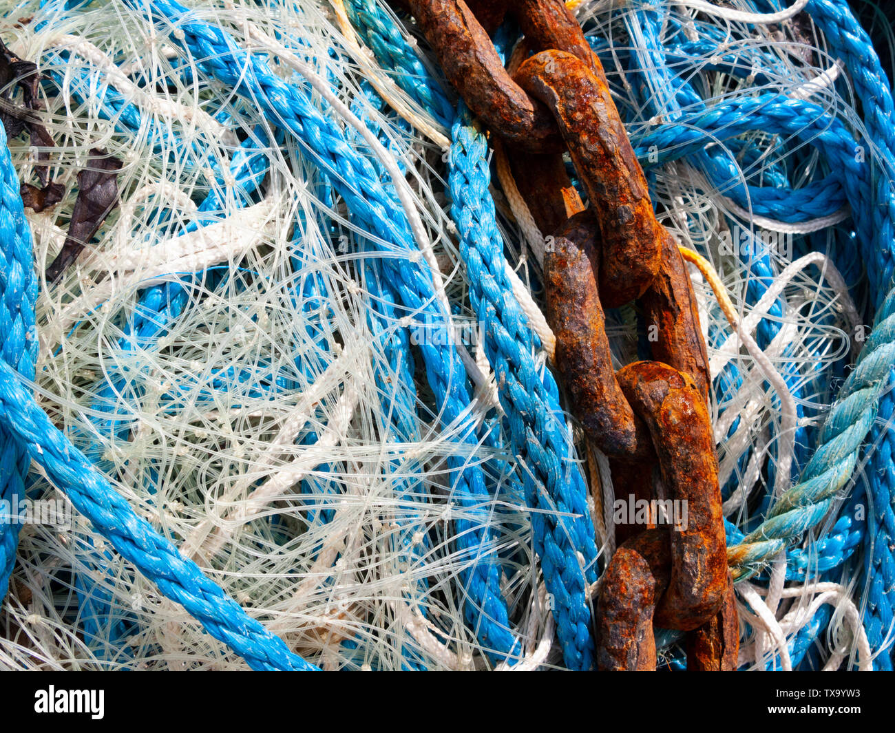 Fishing nets and rusty anchor chain Stock Photo - Alamy