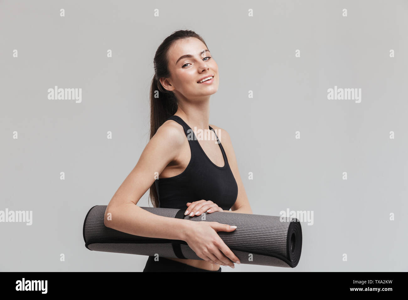 Image of a beautiful young sport fitness woman make exercises isolated ...