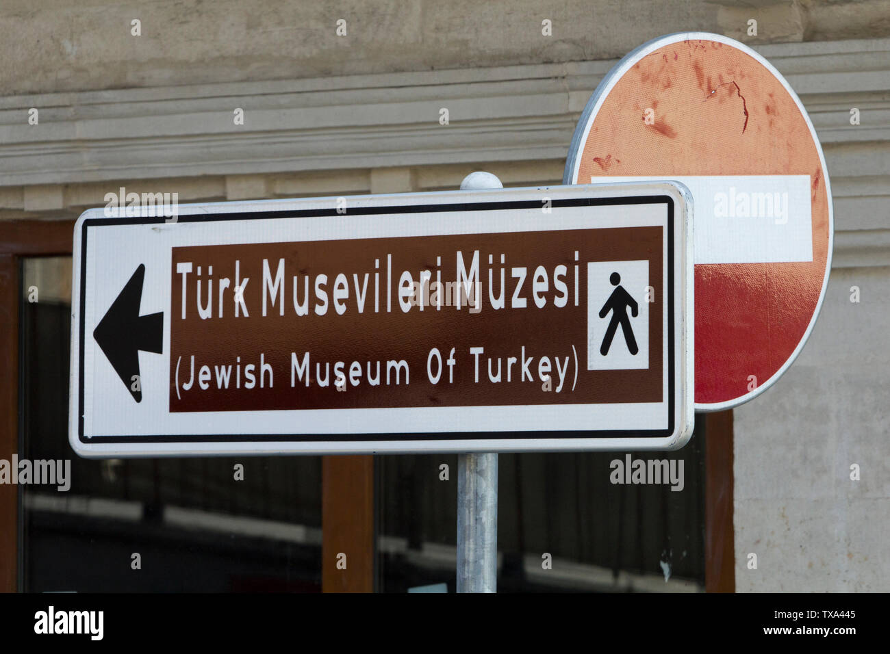 The sign of Jewish Museum of Turkey accompanied by a traffic stop sign ...