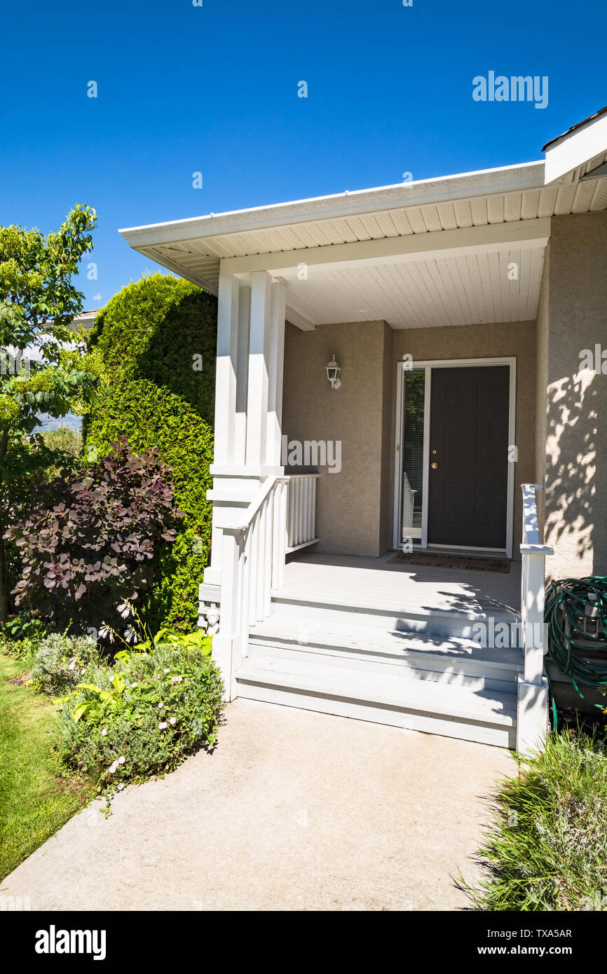 Door steps and concrete pathway leading to main entrance under the ...